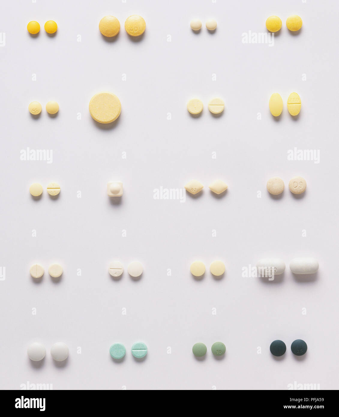 Selection of tablets, single and arranged in pairs Stock Photo - Alamy