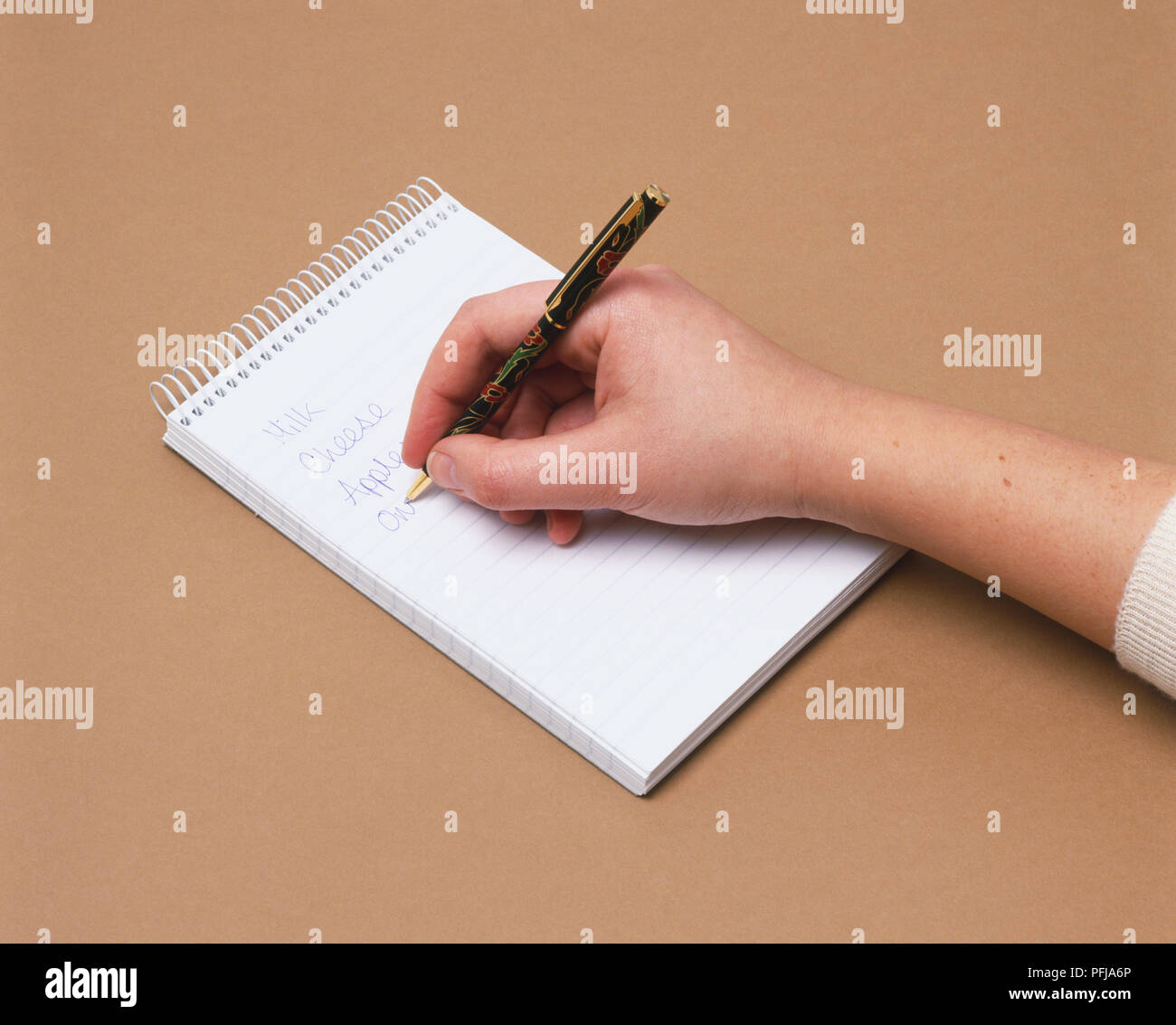 Writing a list on a notepad Stock Photo - Alamy
