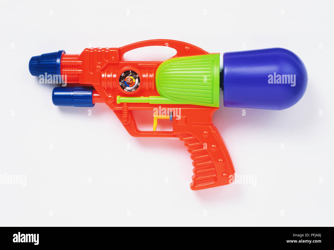 Blue, green and red plastic water pistol Stock Photo - Alamy