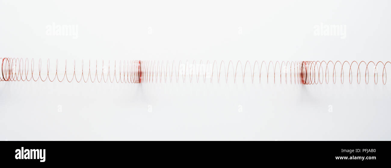Metal spring, extended Stock Photo - Alamy
