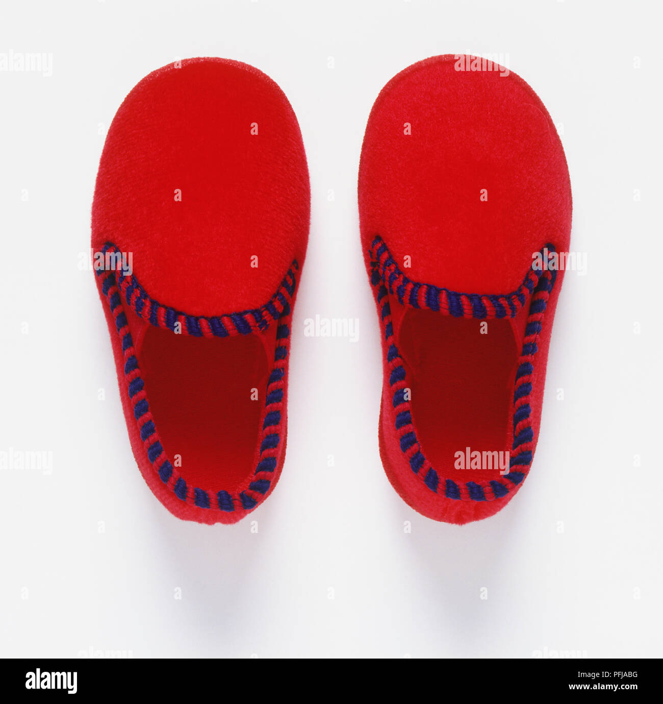 Pair of red and blue slippers, view from above Stock Photo - Alamy