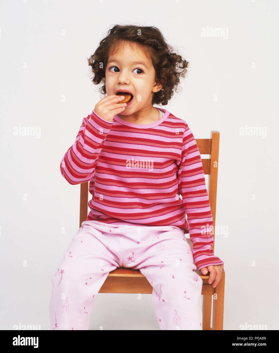 Person putting food in mouth hi-res stock photography and images - Alamy
