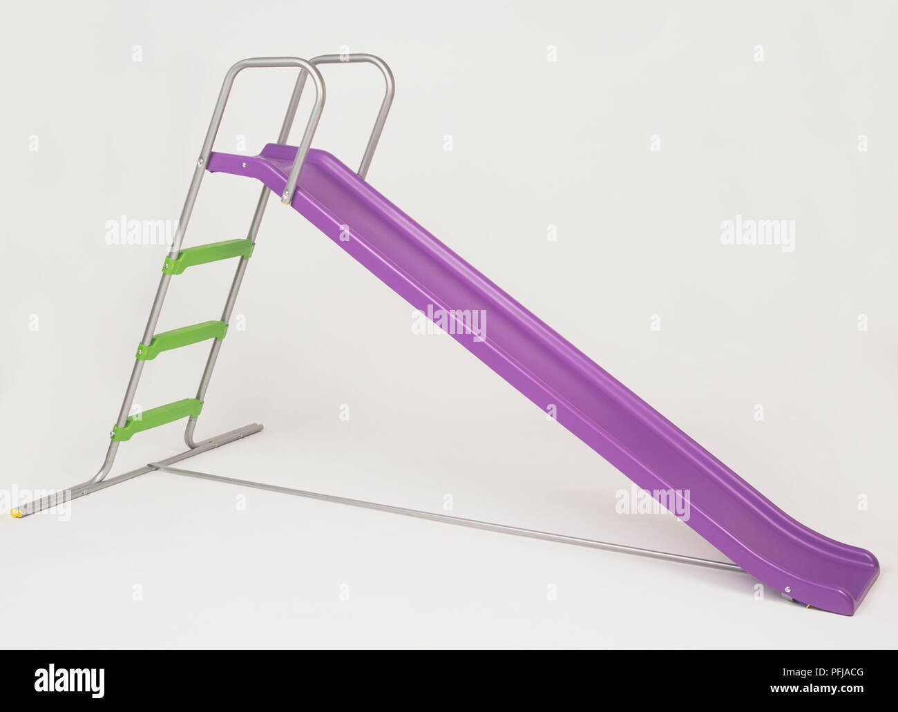 Purple slide with green steps Stock Photo - Alamy