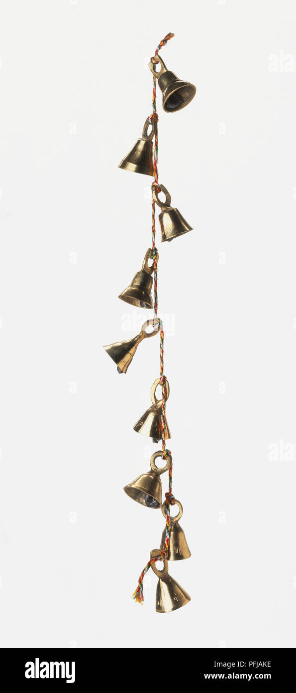 Gold bells on string Stock Photo - Alamy
