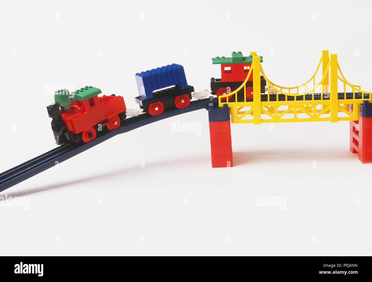 Toy train crossing a bridge Stock Photo - Alamy