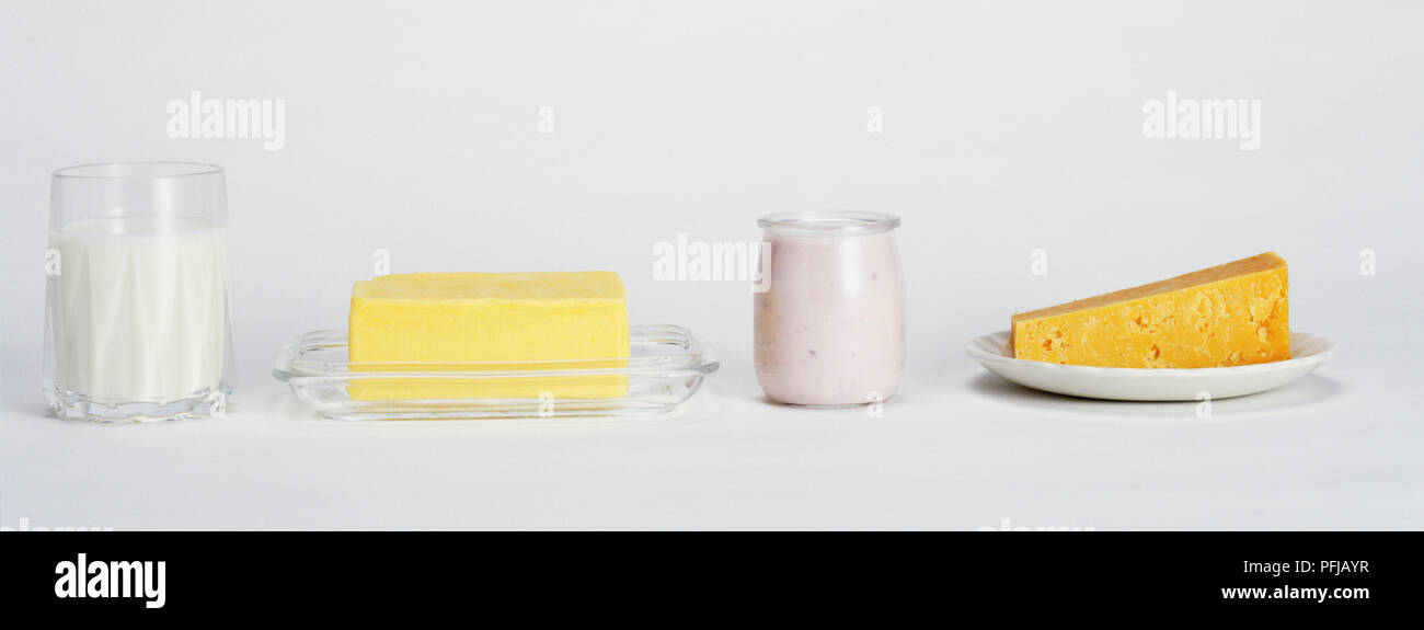 Dairy products, including cheese, yoghurt, butter and glass of milk ...