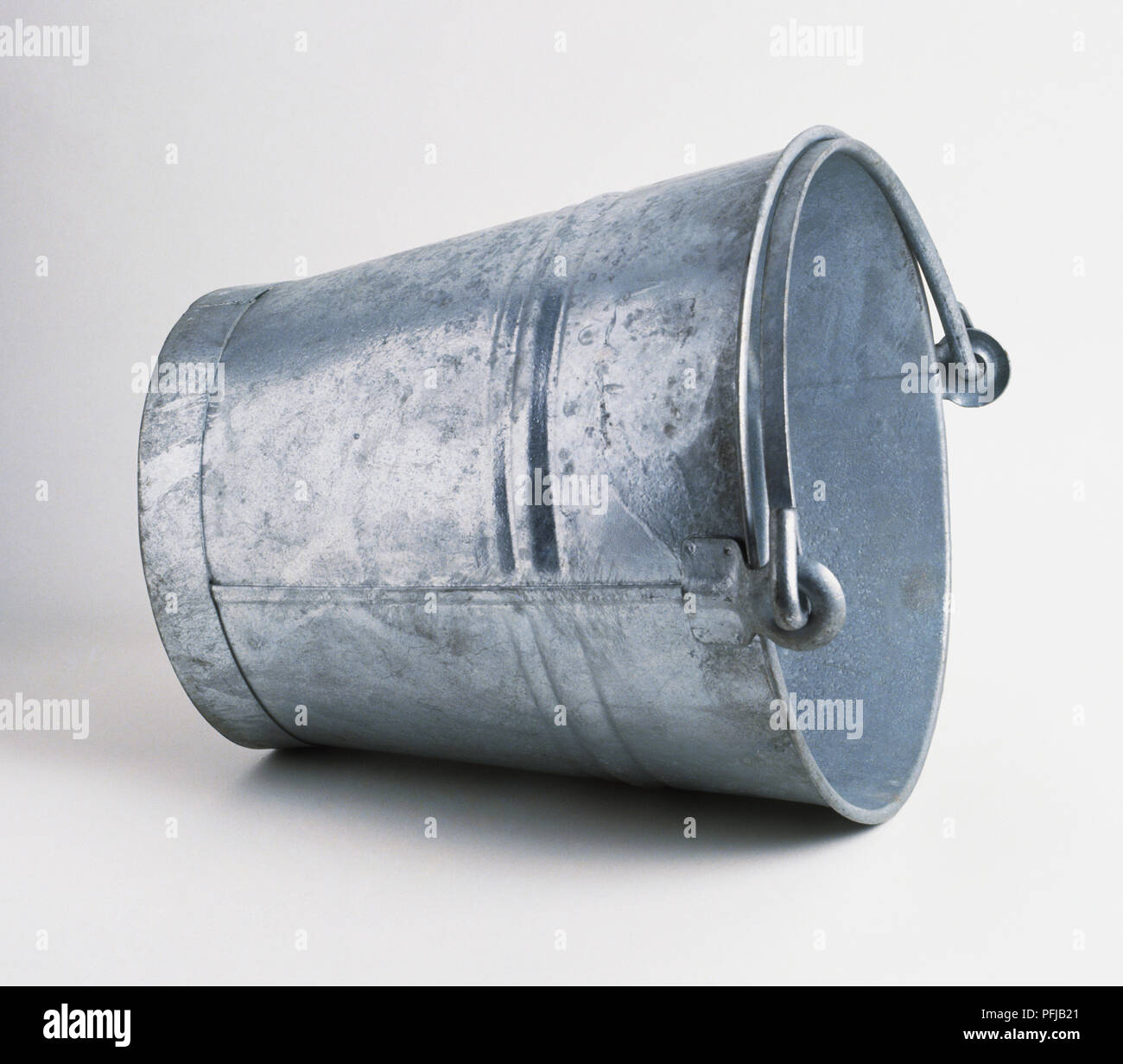 Galvanised metal bucket, on its side Stock Photo - Alamy