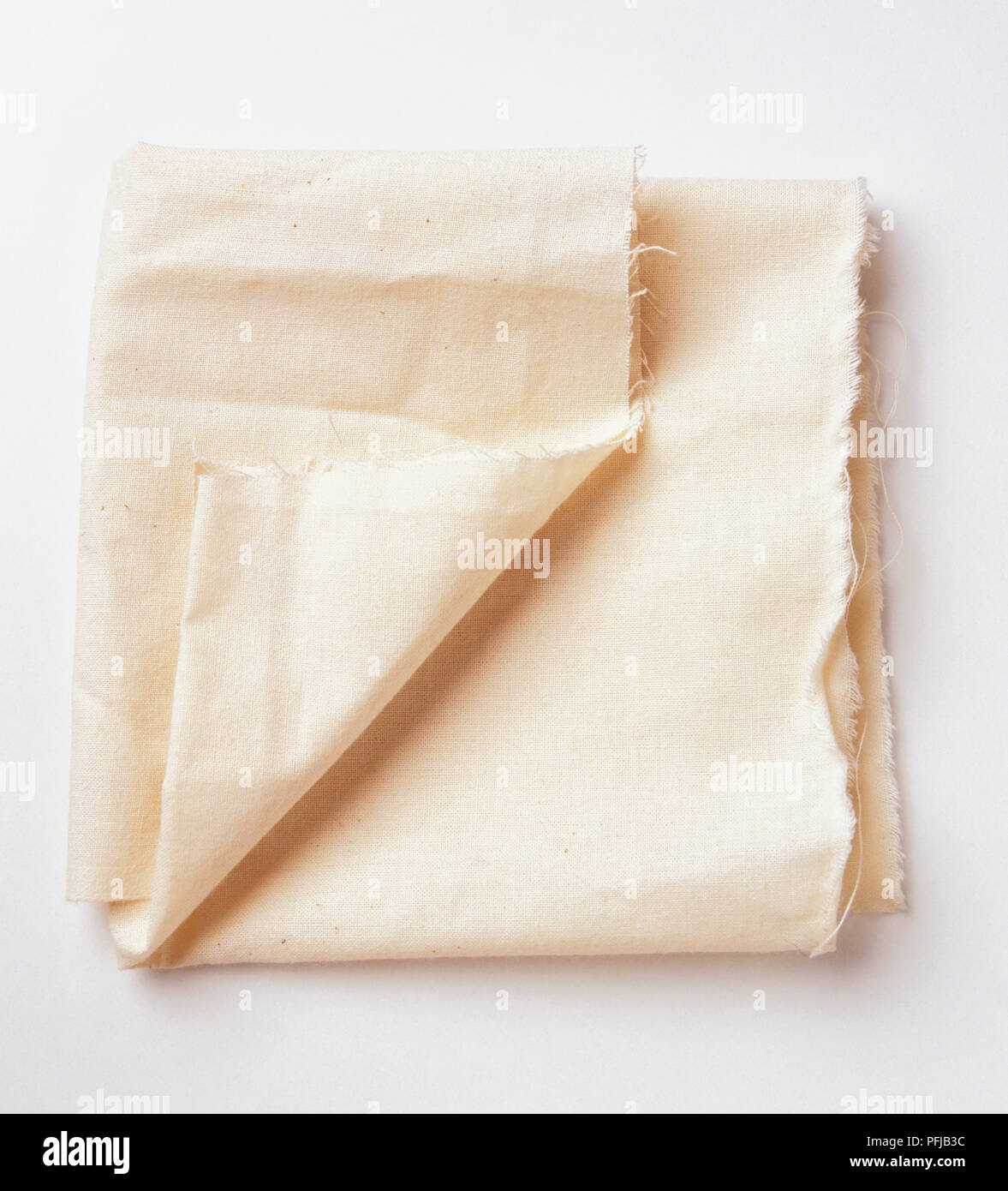 Beige fabric, one corner folded back Stock Photo - Alamy