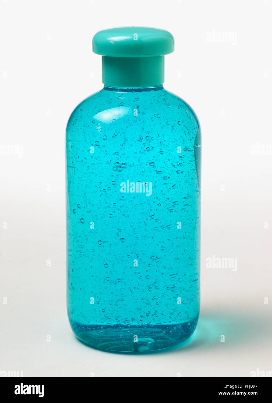 Bottle of turquoise coloured liquid soap Stock Photo - Alamy