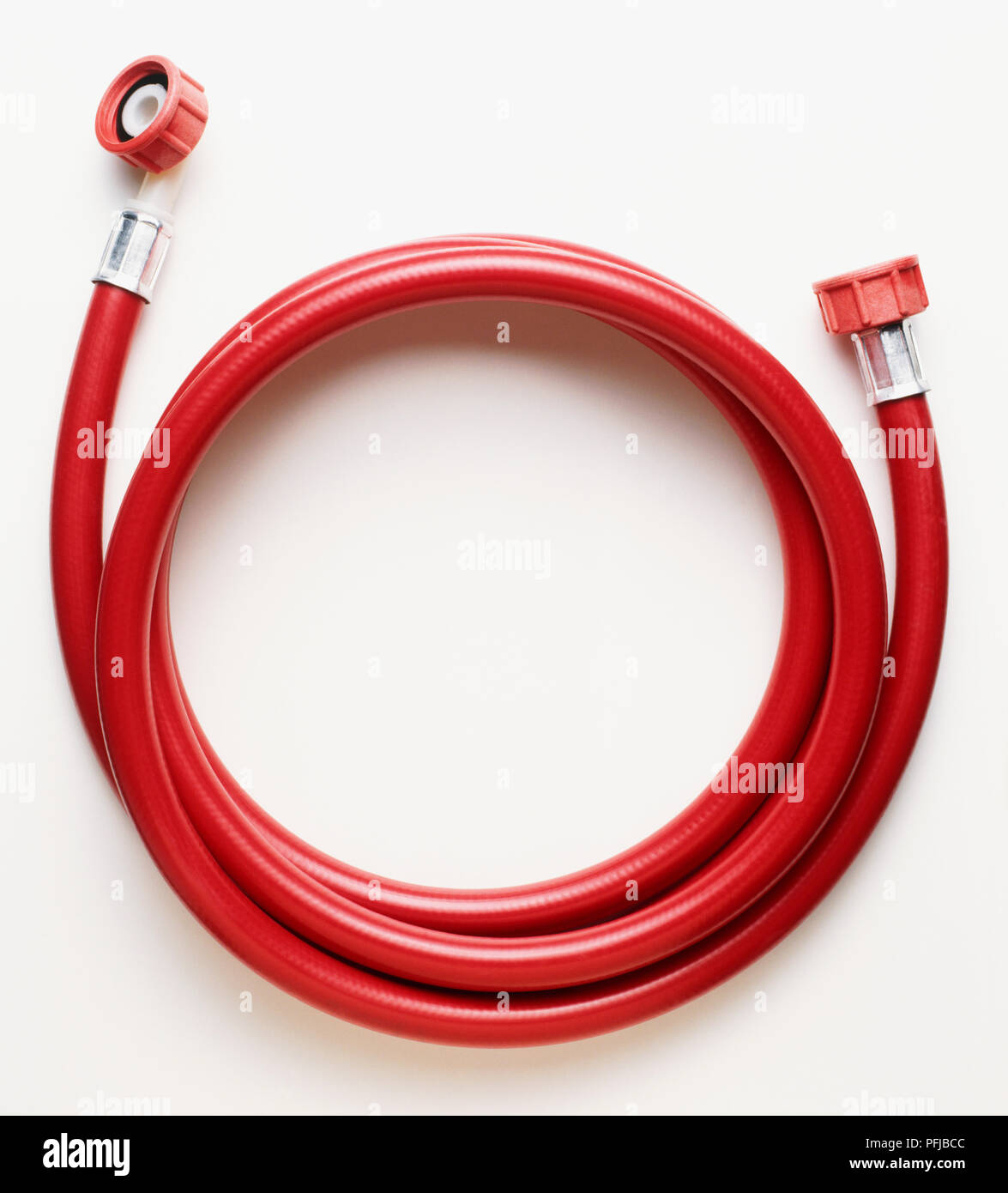 Coiled red water pipe Stock Photo - Alamy