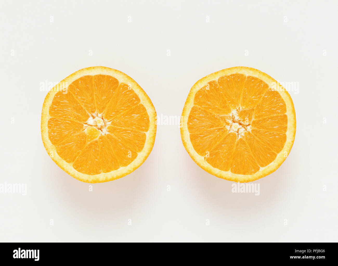 Two orange halves Stock Photo - Alamy