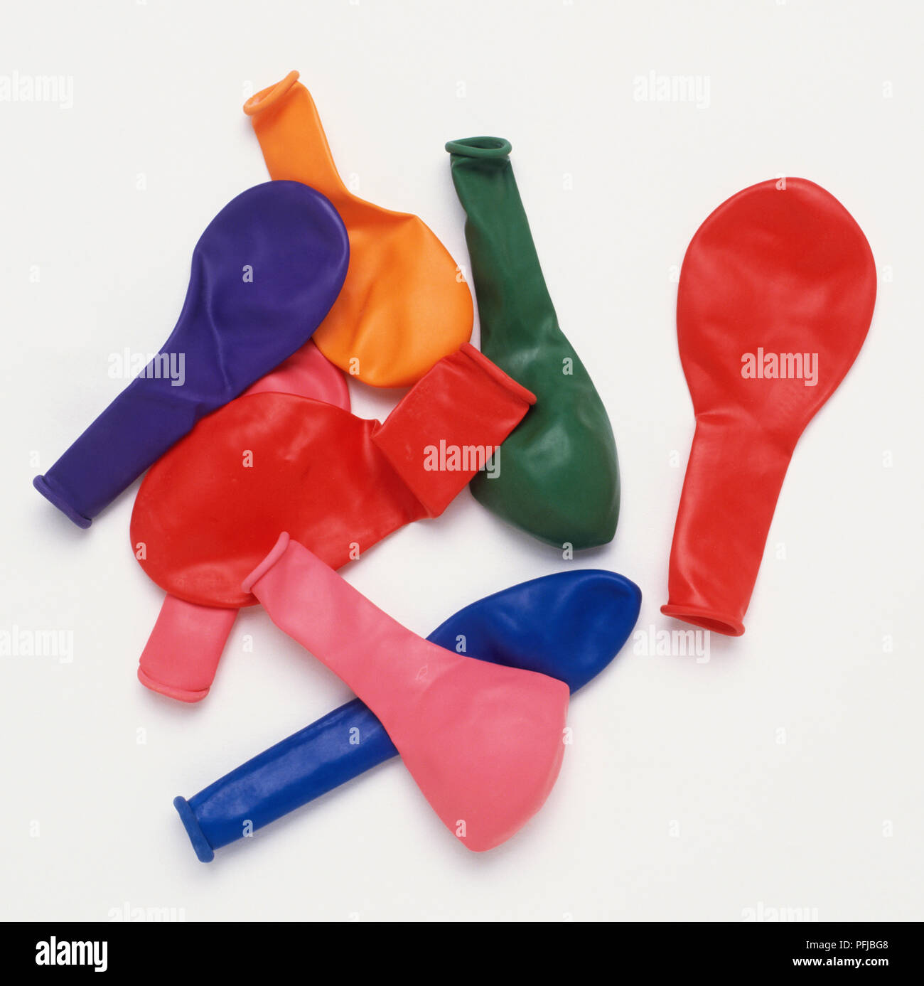 Selection of multi-coloured balloons, deflated Stock Photo - Alamy