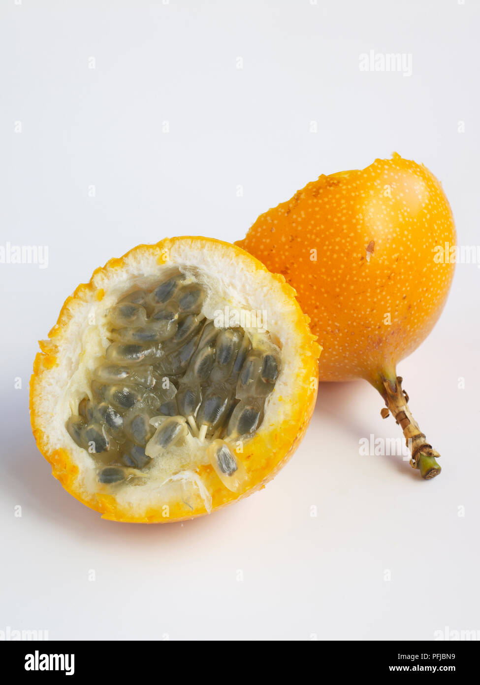 Passiflora edulis (Passion fruit) cross section showing seeds inside ...