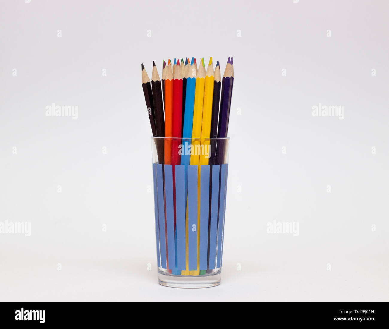 colored pencils in a glass isolated on business background Stock Photo ...