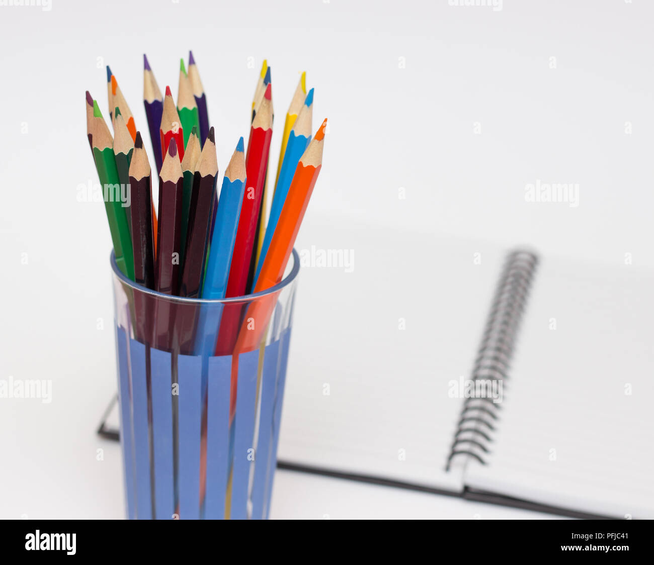 colored pencils in a glass isolated on business background Stock Photo ...