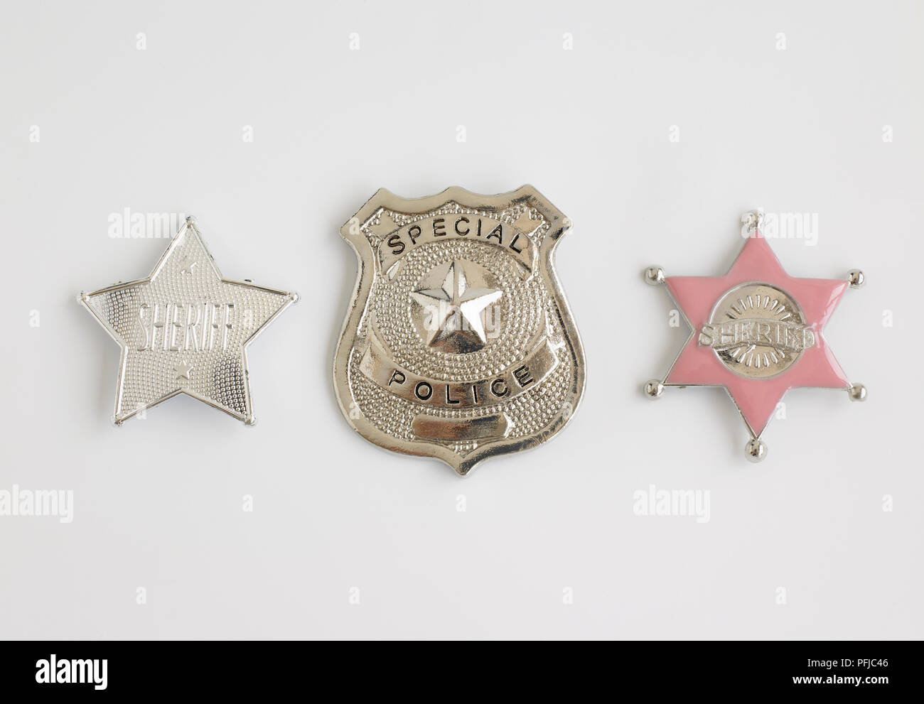 Three toy sheriff's badges Stock Photo - Alamy