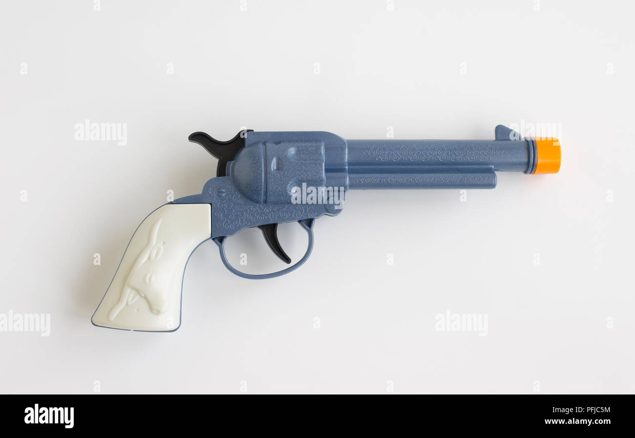 Plastic blue toy revolver, side view Stock Photo - Alamy