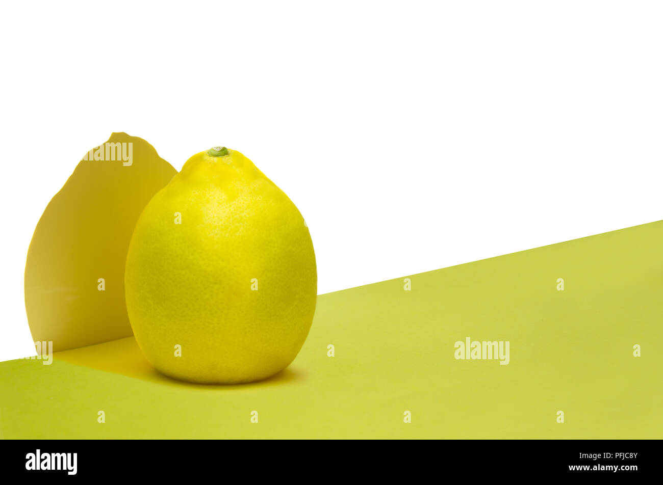 Lemon over white and yellow background with shadow isolated Stock Photo ...