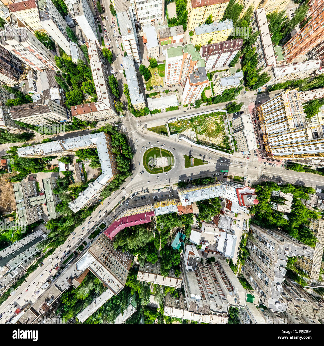Aerial city view with crossroads and roads, houses, buildings, parks ...