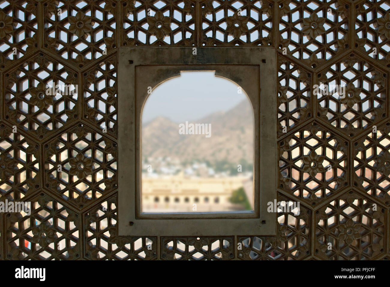 India, Rajasthan, Amber Fort, view of countryside through small window ...