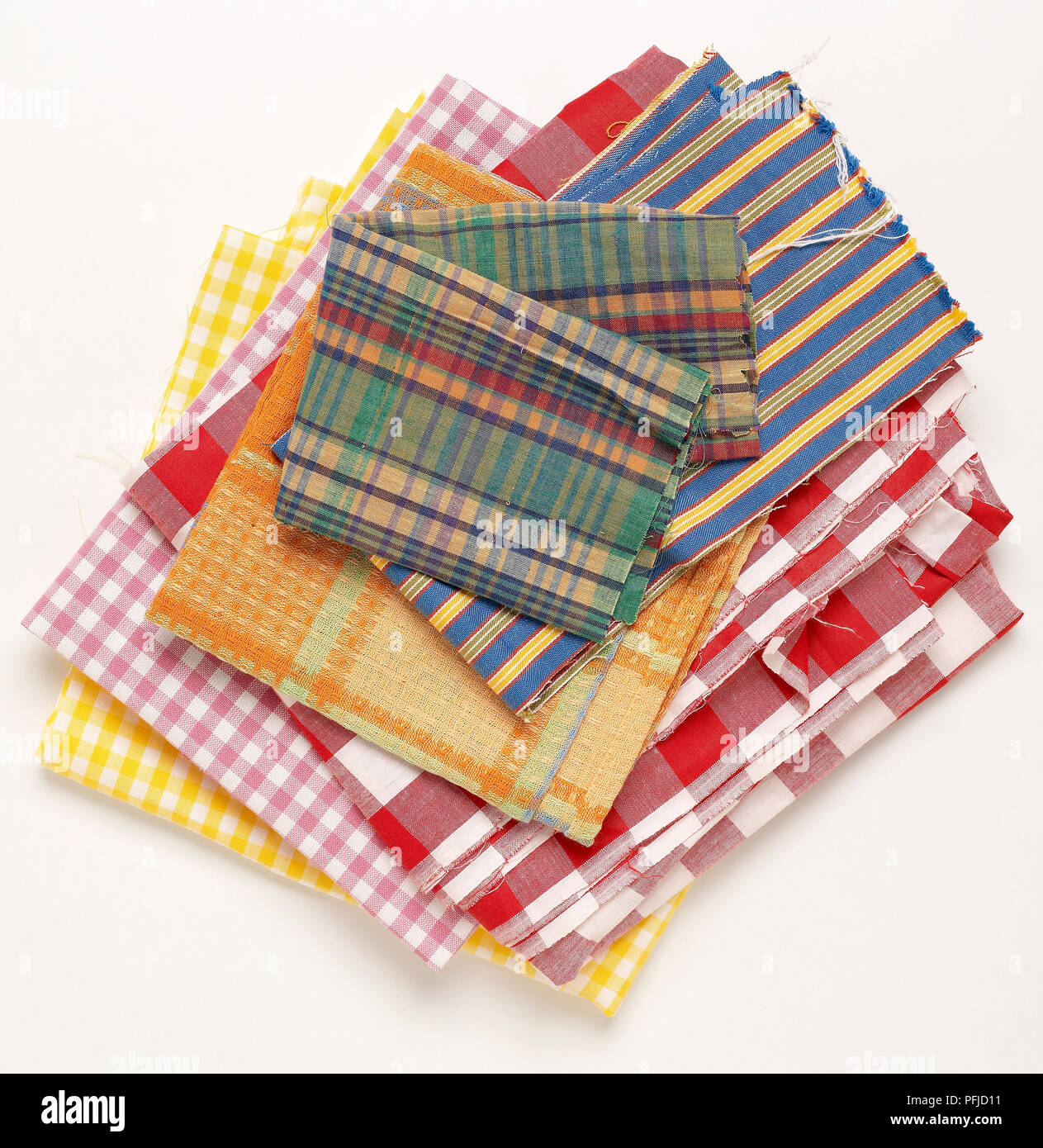 Stack of colourful fabrics Stock Photo - Alamy