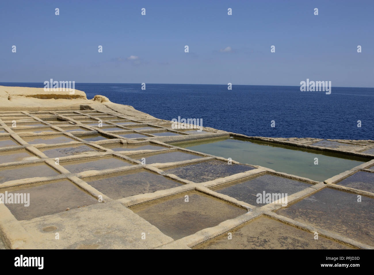 Malta, Gozo, Marsalforn, salt basins by the sea Stock Photo - Alamy