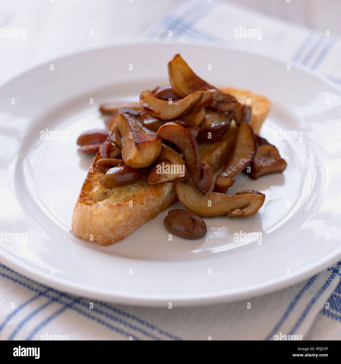 Plate of fried cep mushroom bruschetta Stock Photo - Alamy