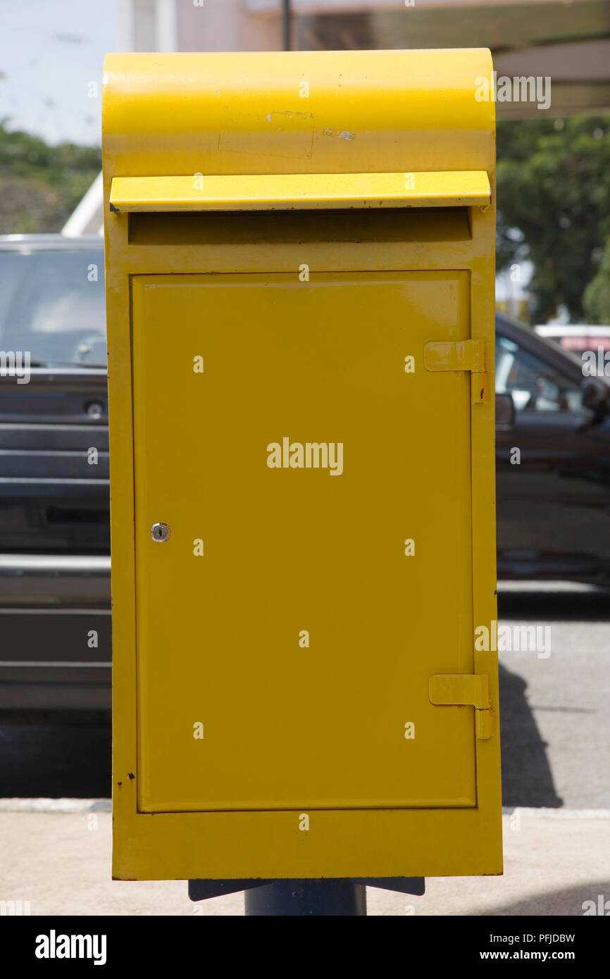 Malaysia, Terengganu, Kuala Terengganu, yellow post box on pavement ...