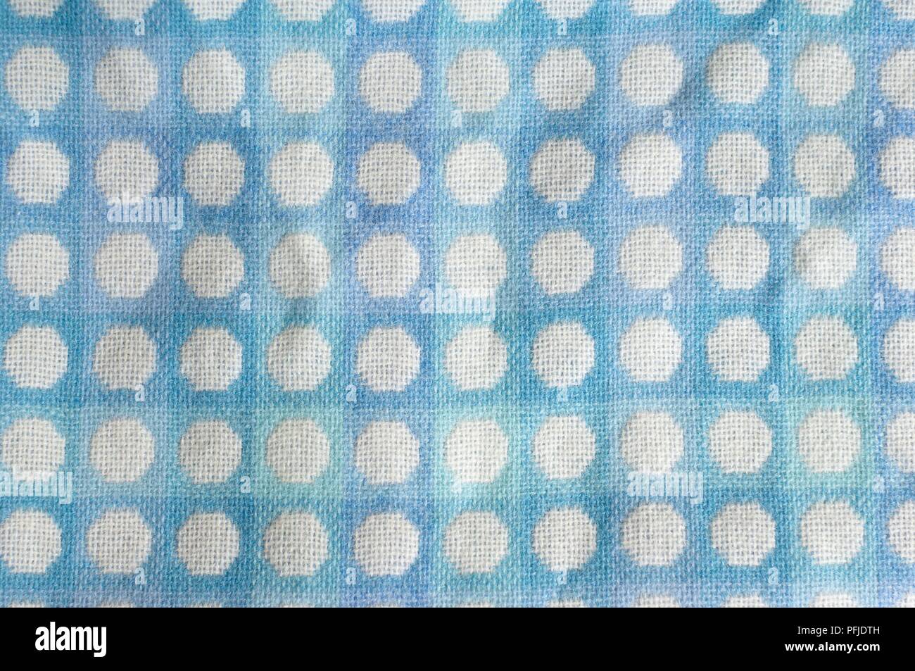 Patterned fabric, blue with white dots Stock Photo - Alamy