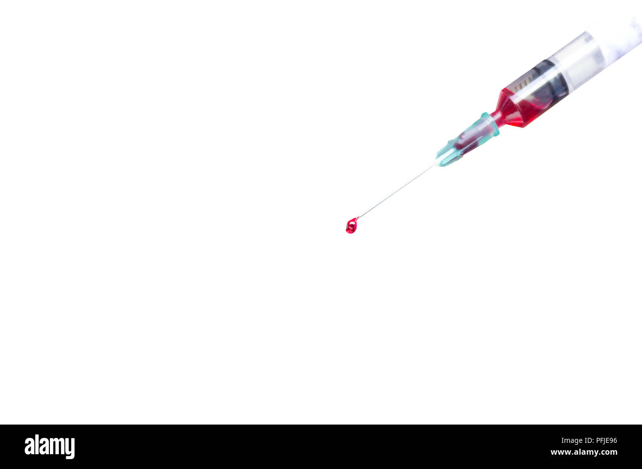 Conceptual drop of red liquid on the needle of a syringe isolated in ...