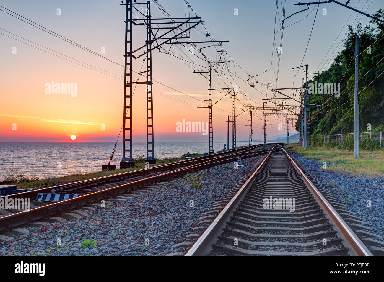 Beautiful landscape of a railroad and towers of traction line on the ...