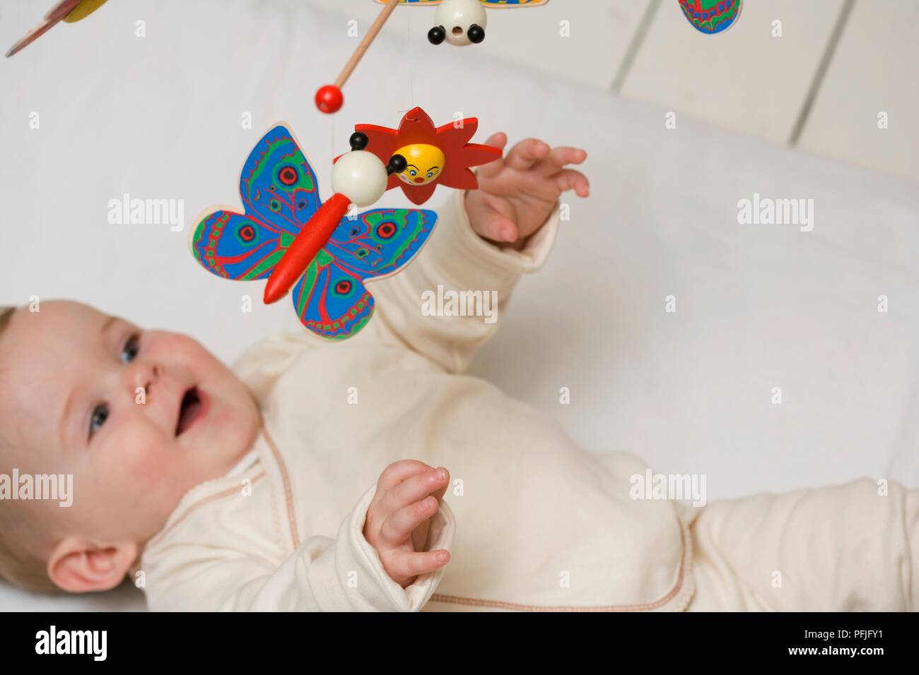 Baby and reaching arms hi-res stock photography and images - Alamy