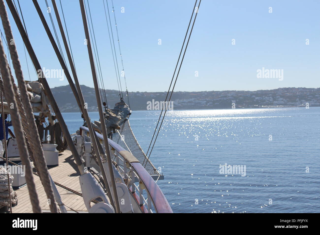 Isle of Mykonos from the bow of a clipper ship Stock Photo - Alamy