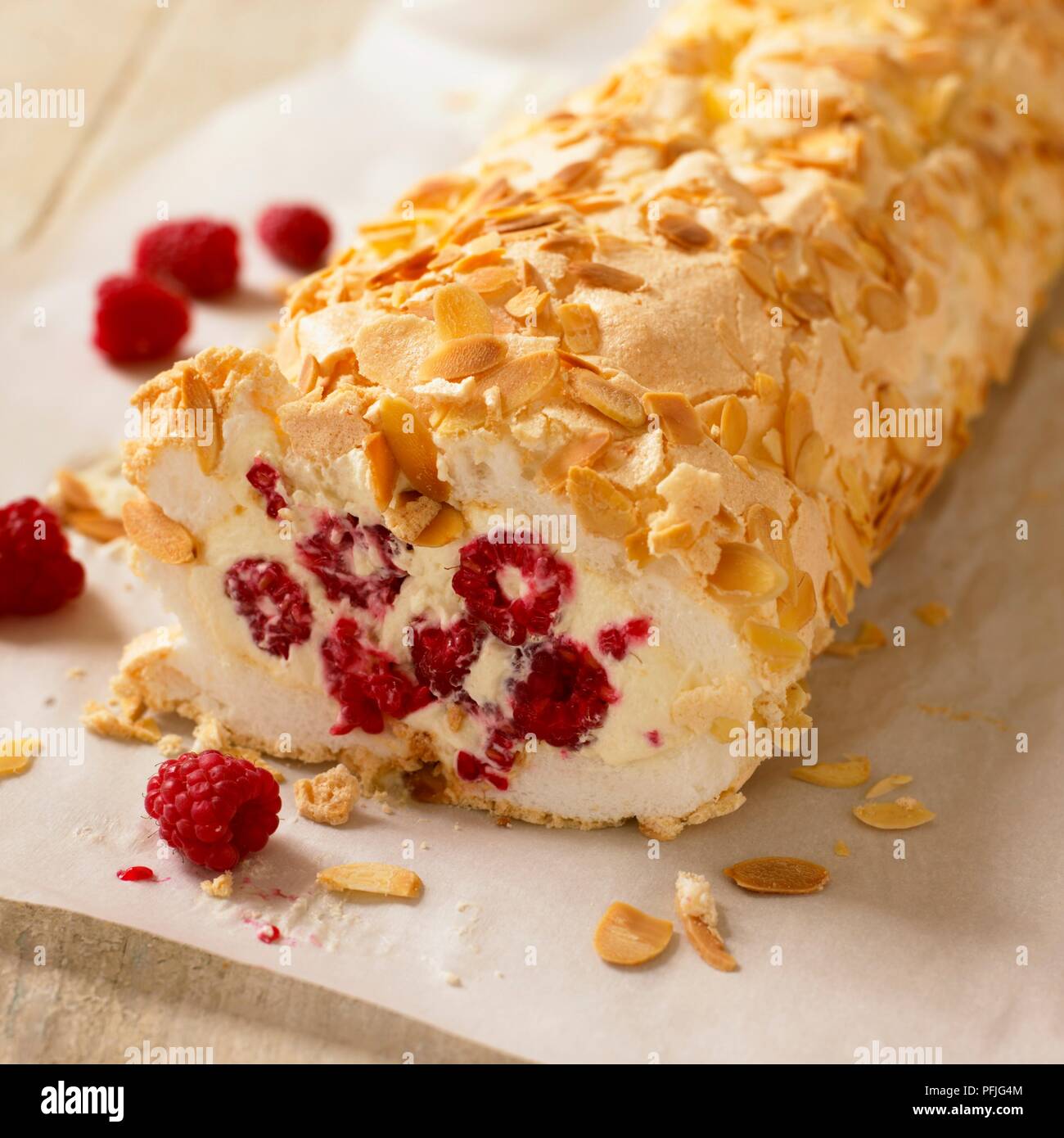 Raspberry meringue roulade, cross section Stock Photo - Alamy