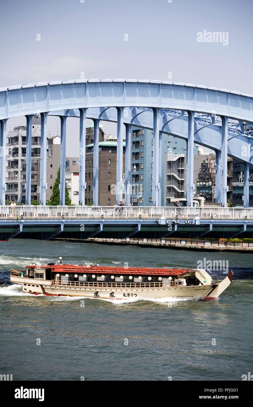 Japan, Tokyo, Koto-ku, view of Eitai Bridge and boat travelling on ...