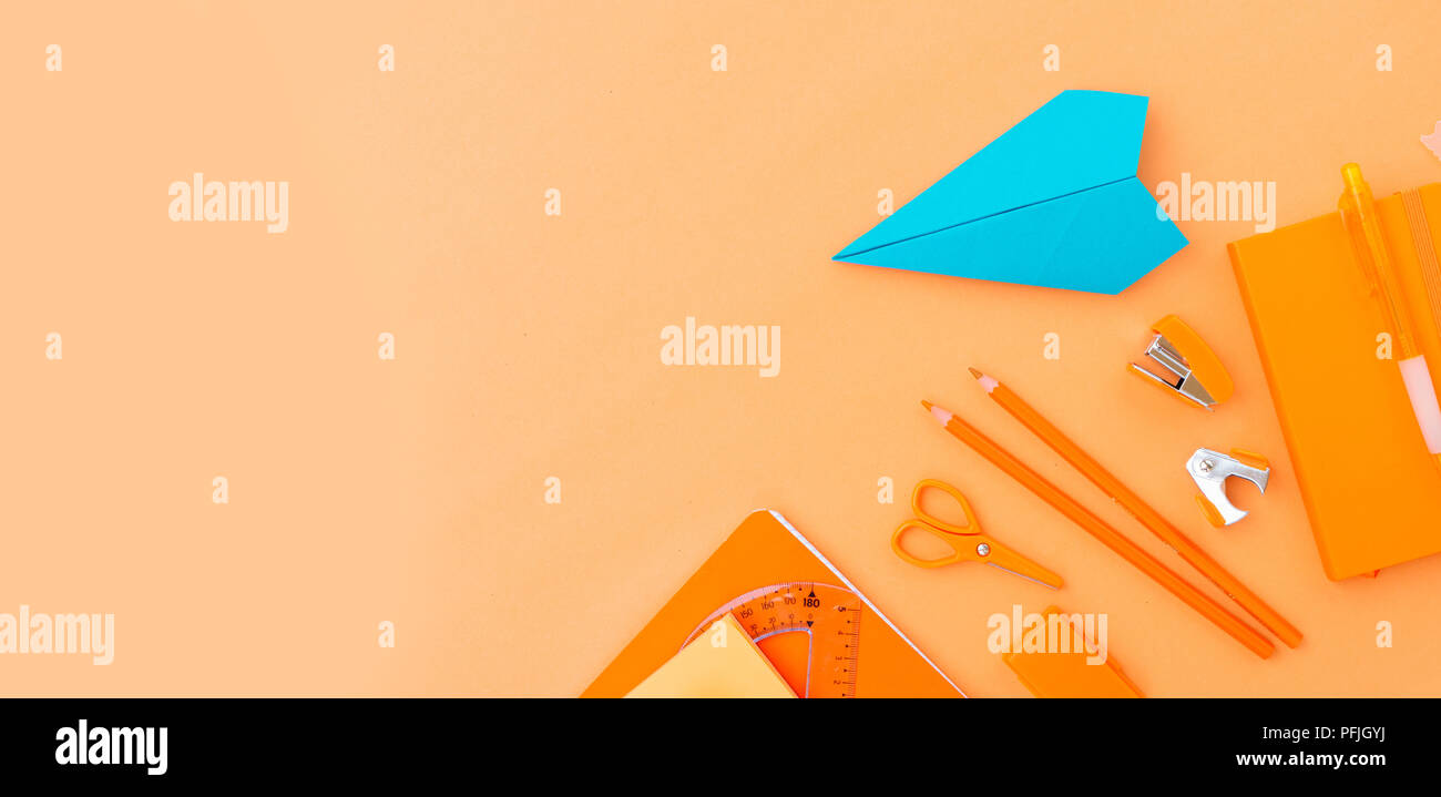 Back to school styled border with school supplies and paper blue plane ...