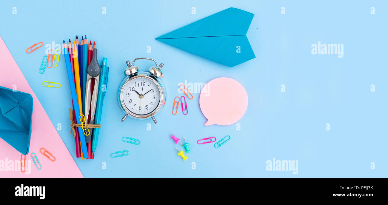 Back to school styled flat lay scene with multicolored school supplies ...