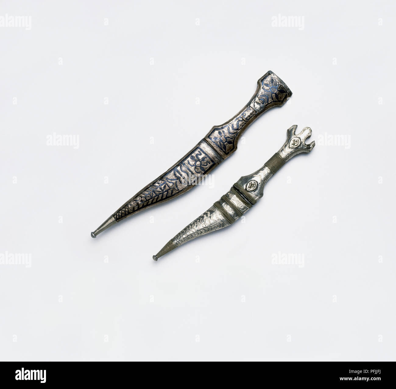 Silver Bedouin dagger with intricate handle and scabbrad, close-up ...