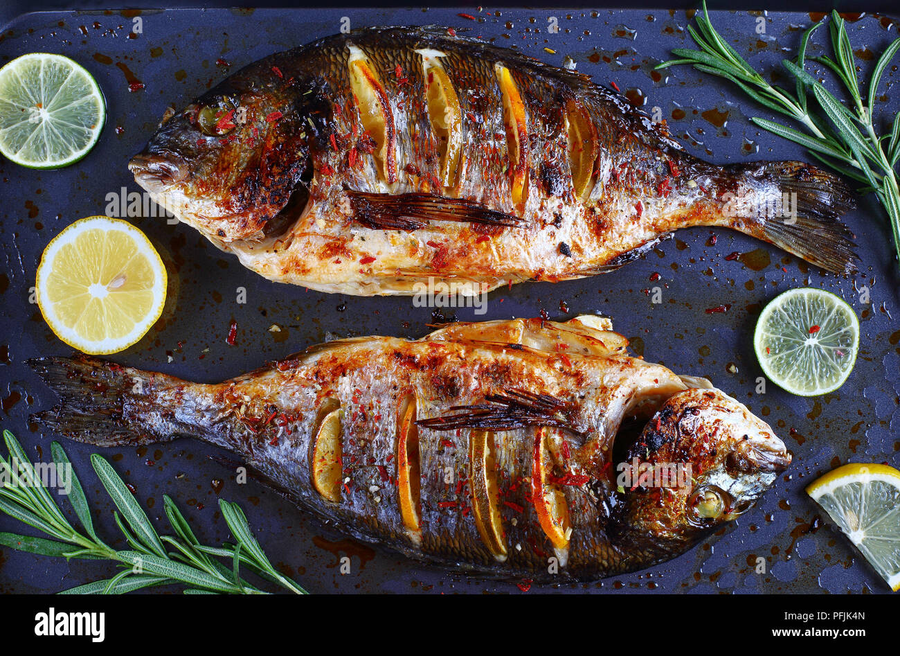 Dorado fish on baking sheet hi-res stock photography and images - Alamy