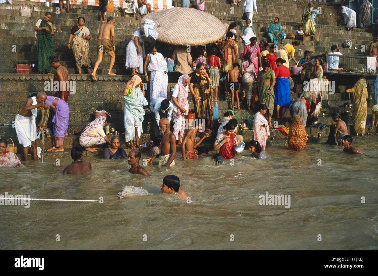 India, Varansi, bathers stepping into River Ganges Stock Photo - Alamy