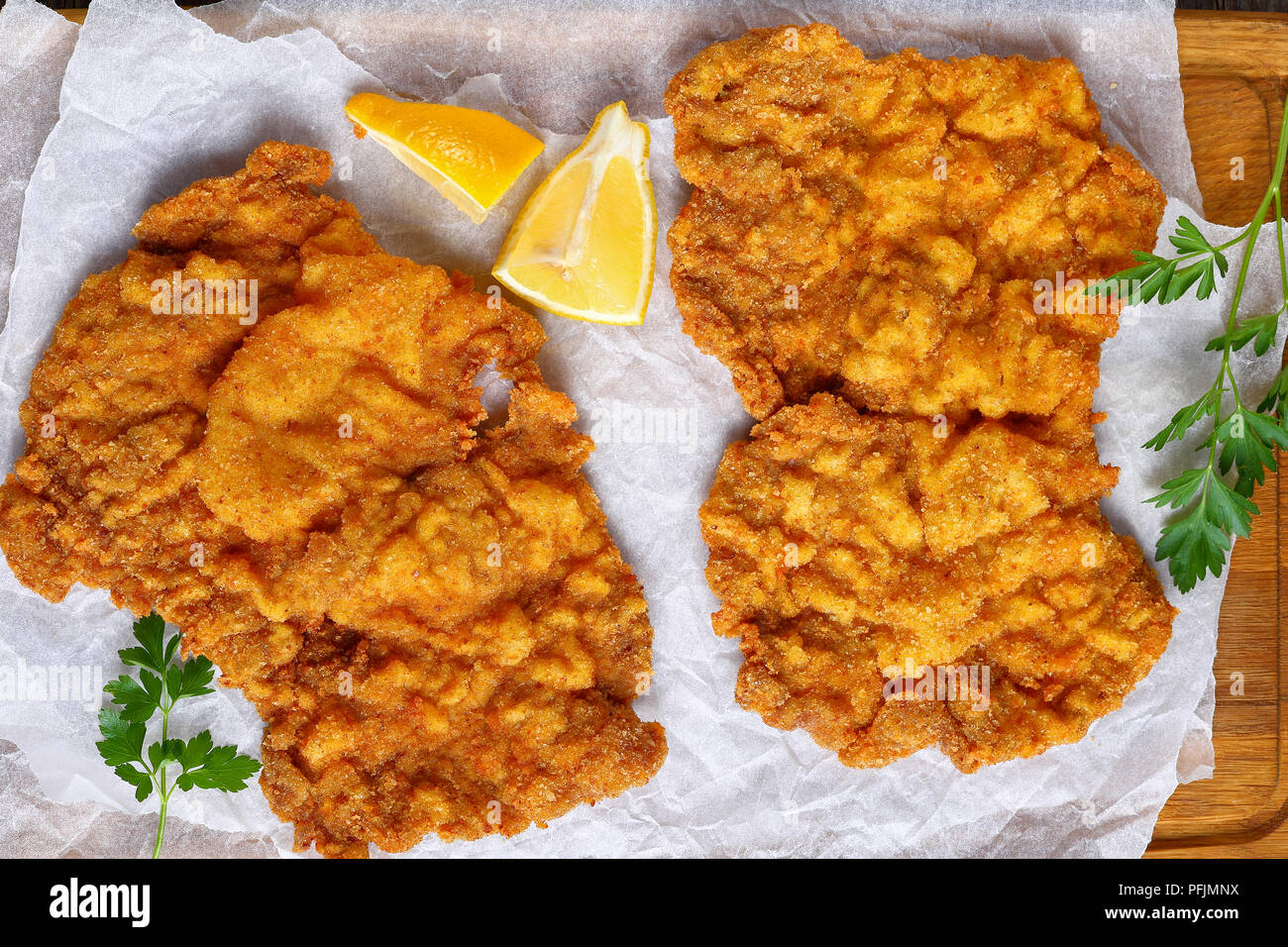 delicious golden brown two Wiener schnitzel prepared from veal slices, butterfly wing cut ...