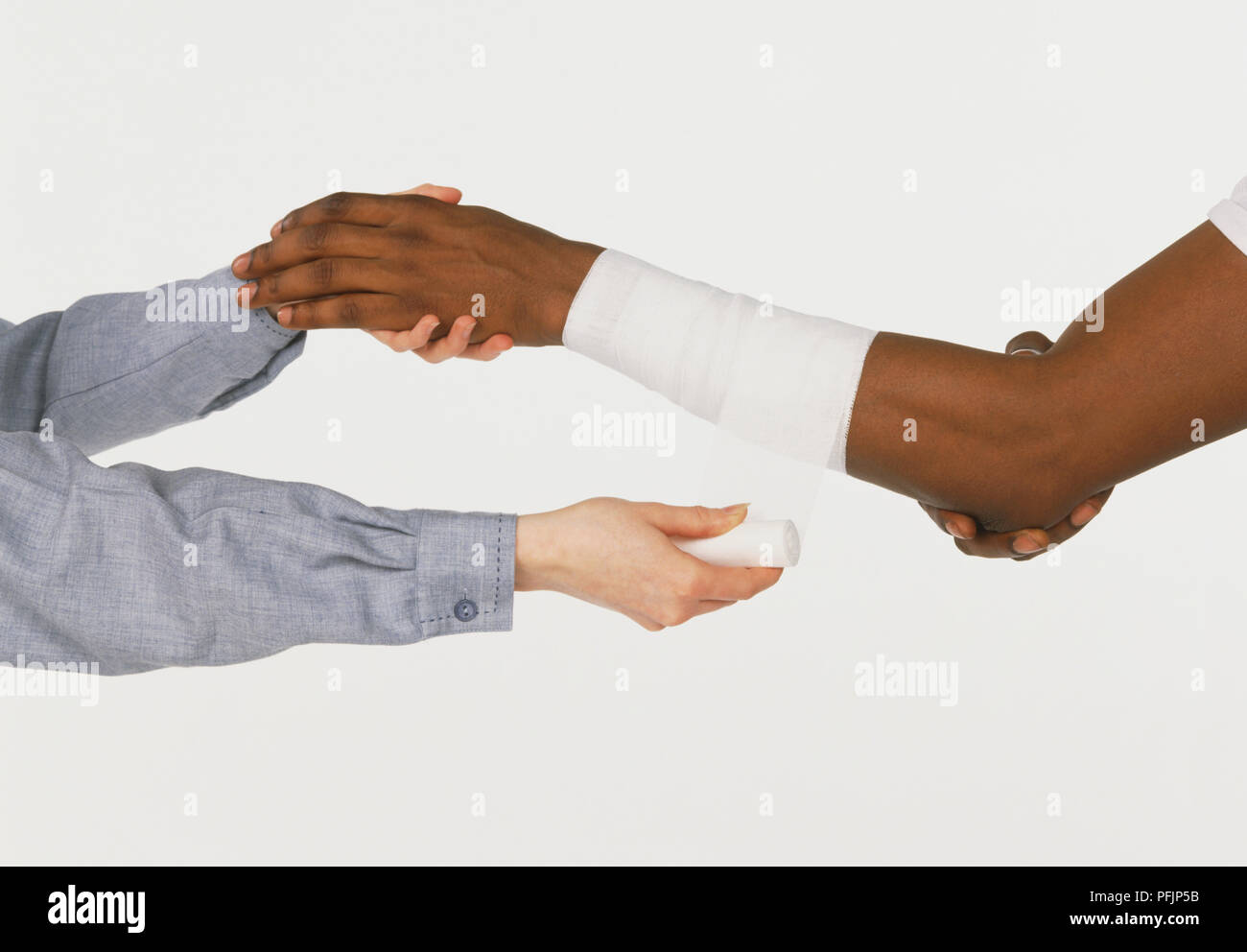 Person's forearm being bandaged by another person, side view Stock ...