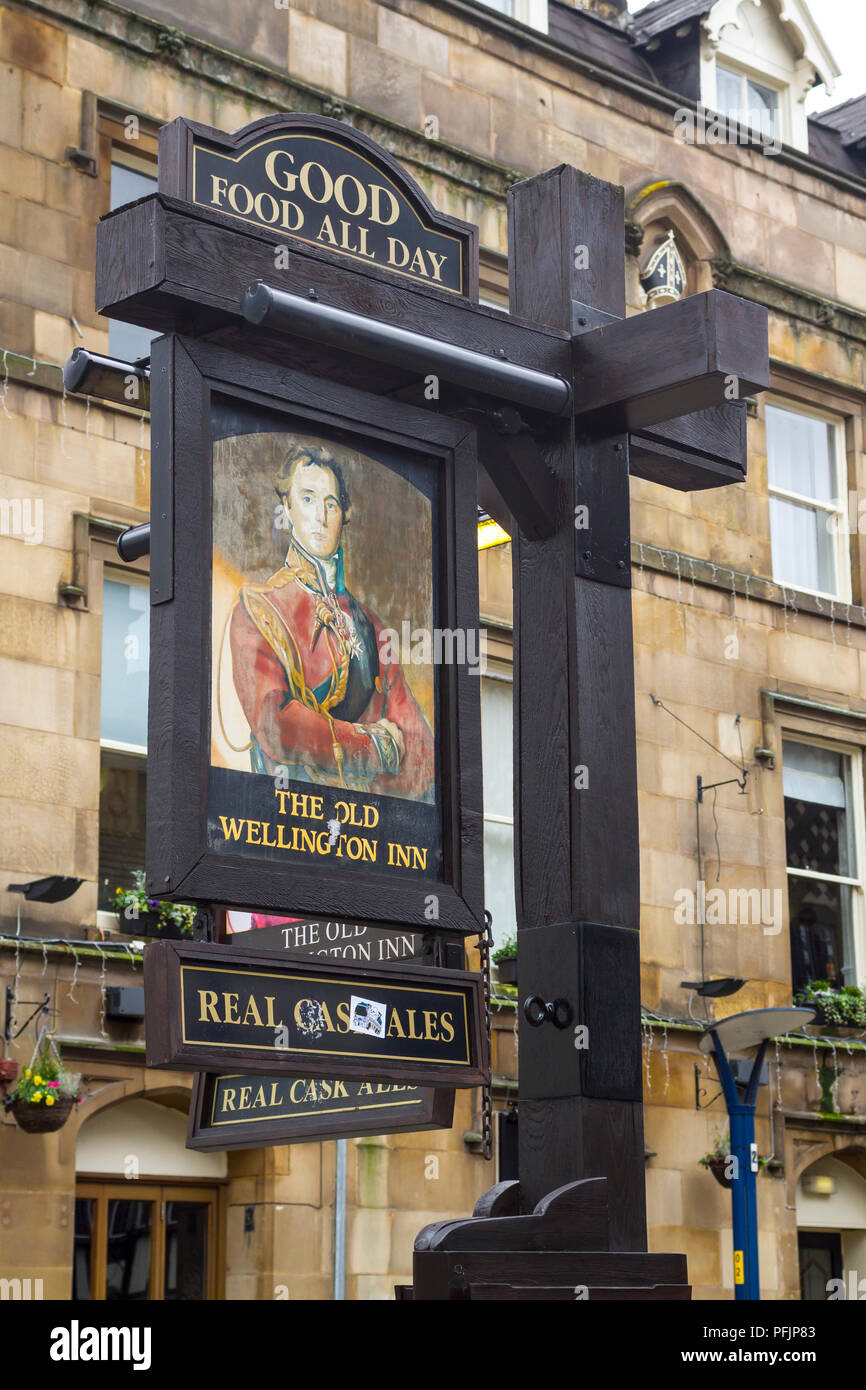 Sign for The Old Wellington Pub in Cathedral Gardens, Manchester Stock ...