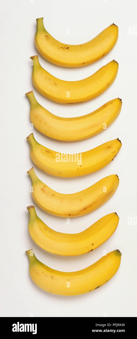 Seven bananas in a row Stock Photo - Alamy