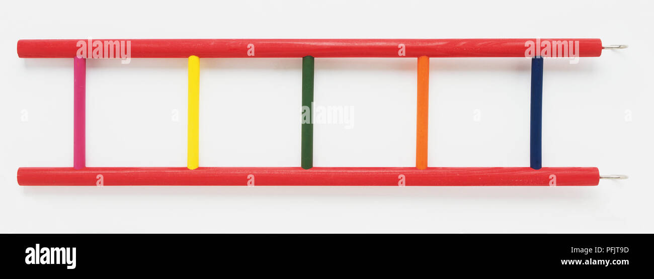 Wooden red ladder, with coloured steps Stock Photo - Alamy