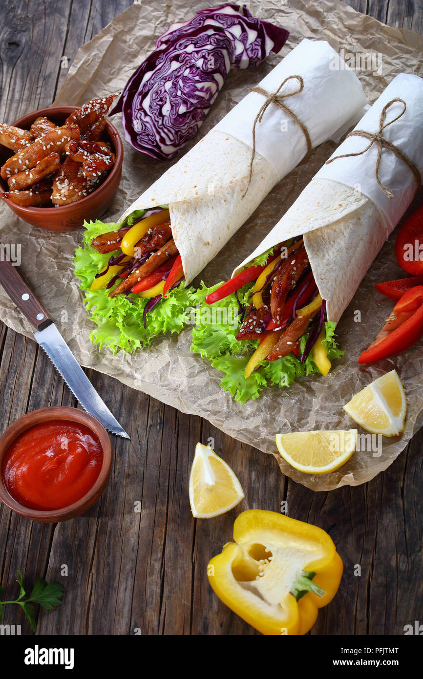 close-up of two delicious fresh juicy flatbread shawarma wraps with ...