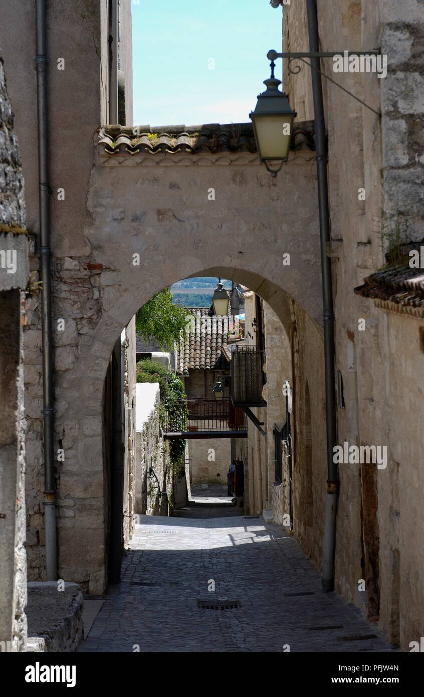 France, Monflanquin, archway over narrow alleyway in town Stock Photo ...