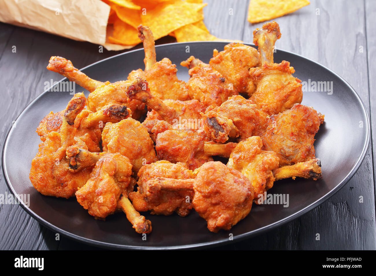 delicious deep fried battered crispy chicken winglets with exposed ...