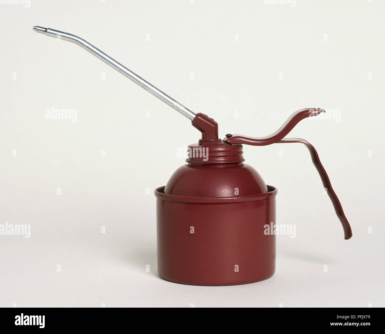 Brown oil can with long nozzle, side view Stock Photo - Alamy