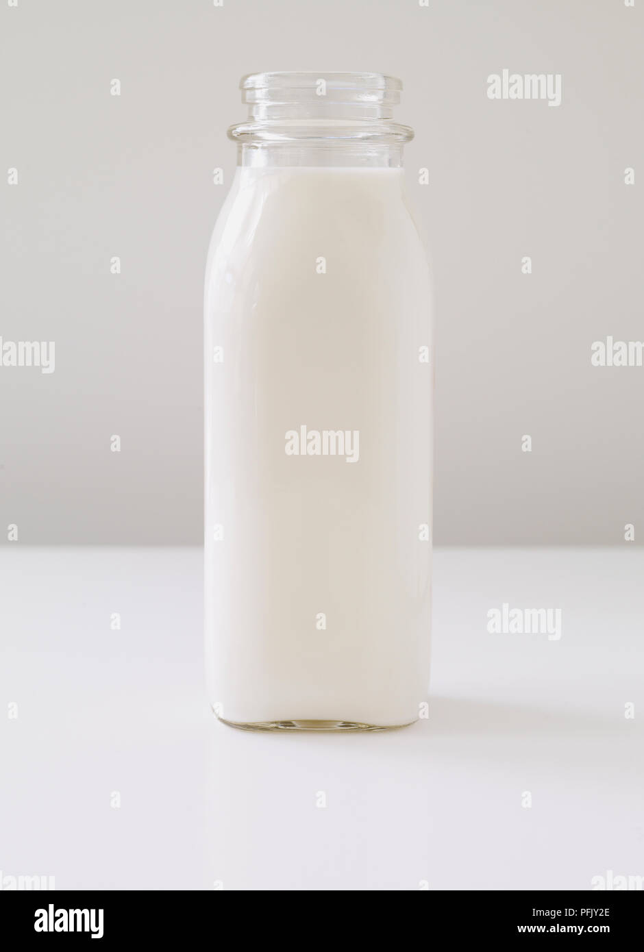 Open bottle of milk Stock Photo - Alamy